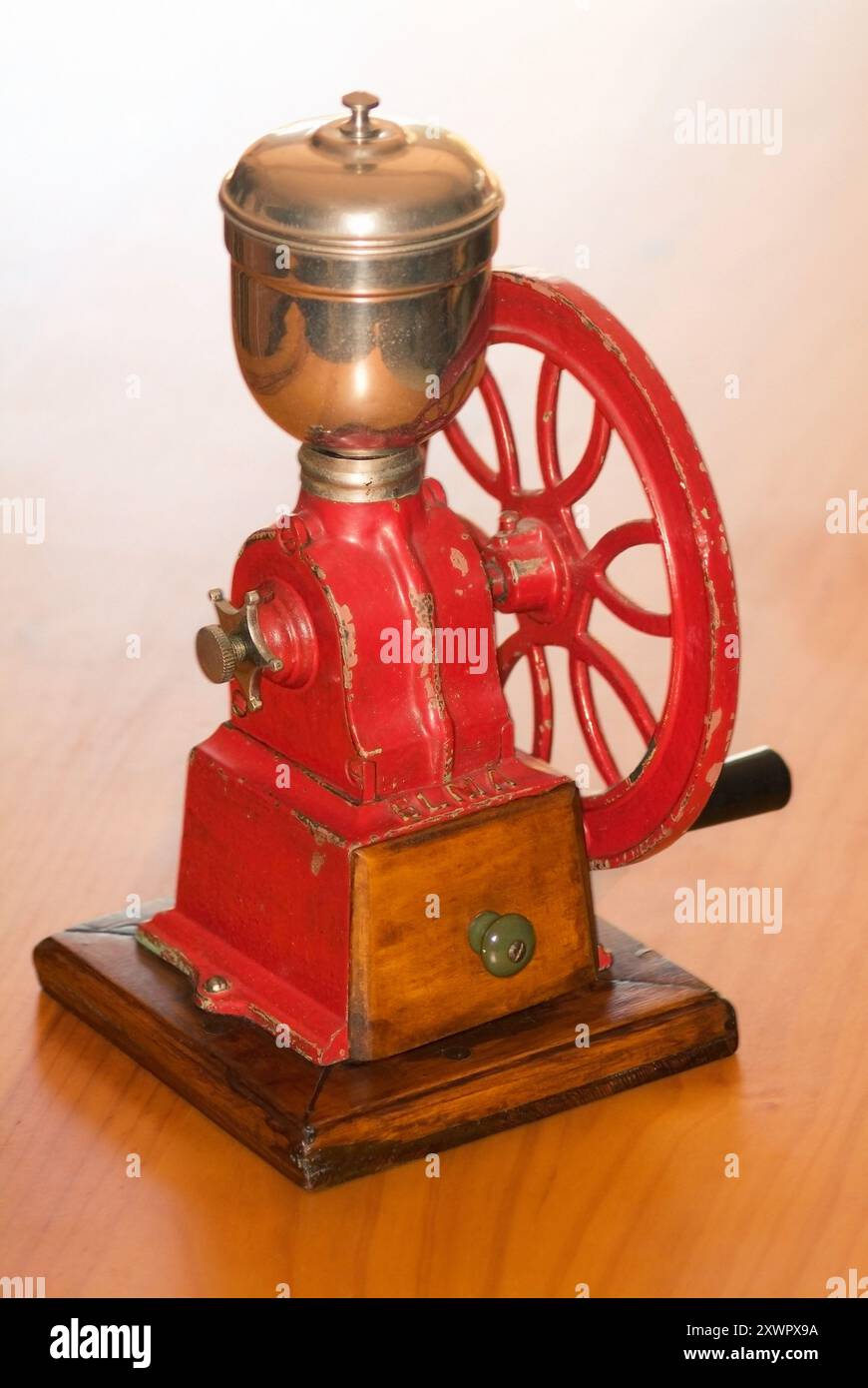 Vintage wheel coffee grinder Stock Photo - Alamy