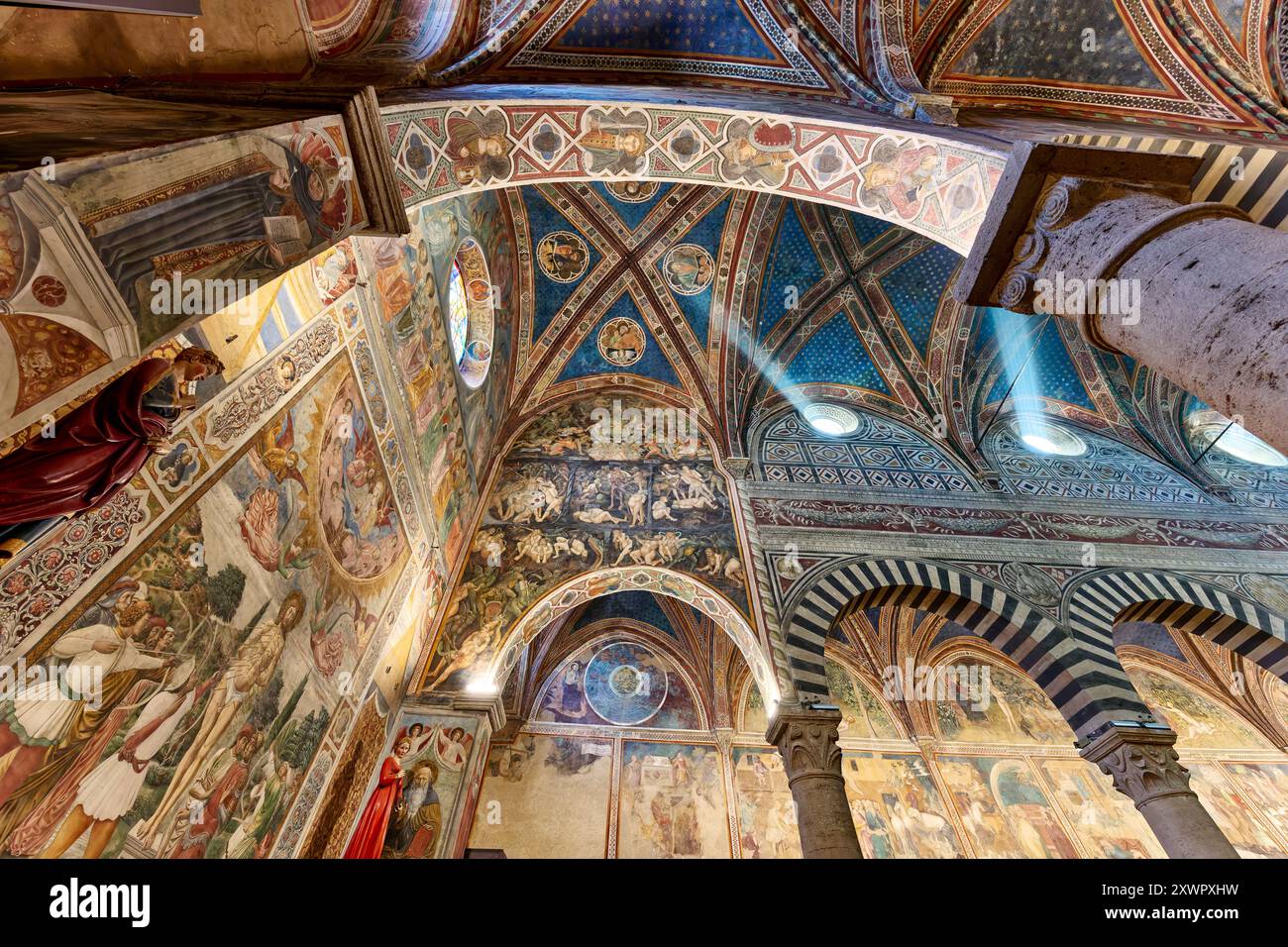 The interior with frescos of the Collegiata di Santa Maria Assunta ...