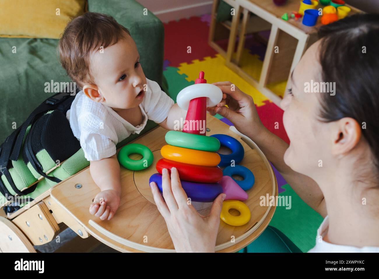 Mother spending useful time with her son with movement disorders ...
