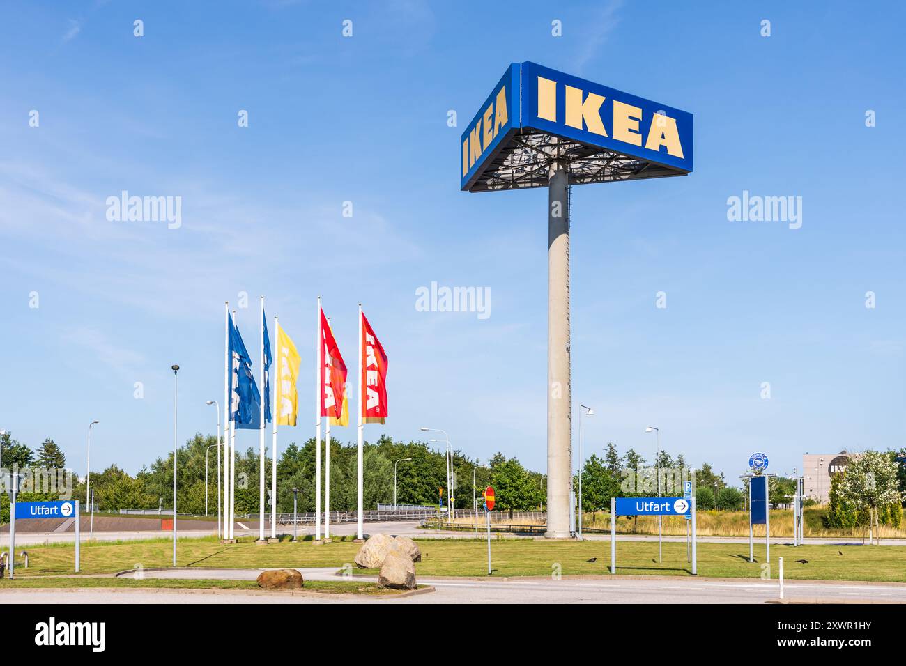 A tall three-sided billboard shows the IKEA sign at the entrance of the ...