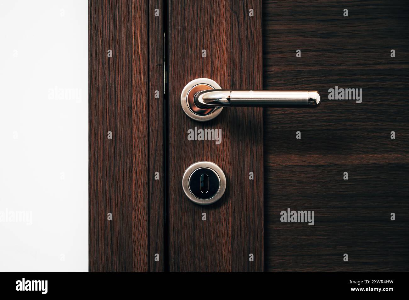 Interior door metallic handle with keyhole as background Stock Photo ...