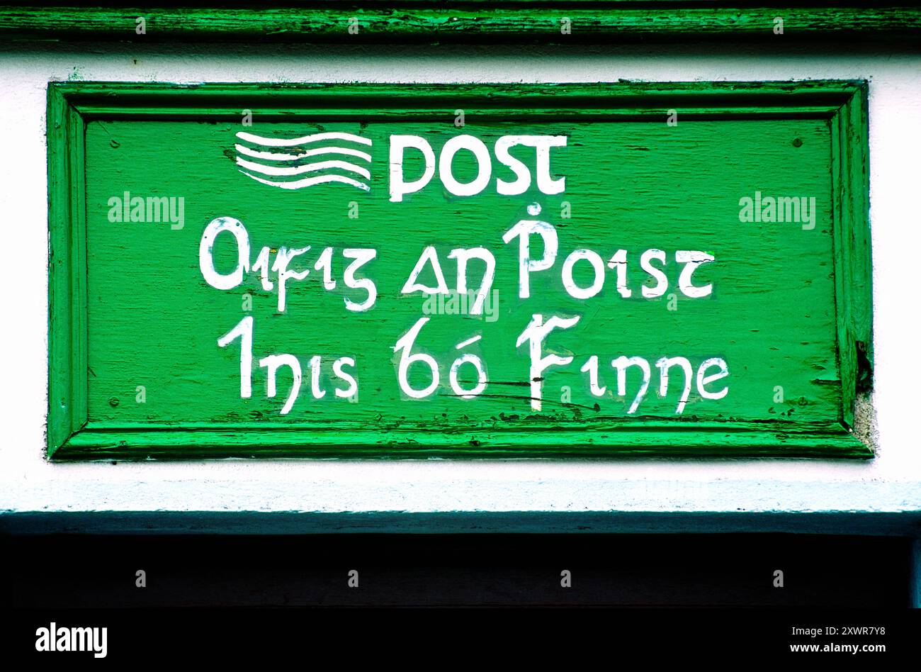 Post office sign in Irish Gaelic language hand painted on island of ...