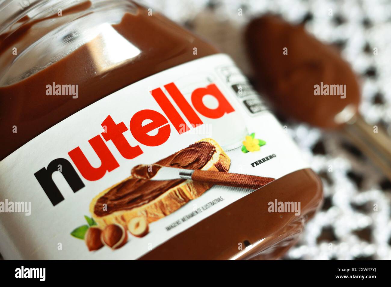 in this photo illustration, a Nutella logo seen displayed on a bottle ...