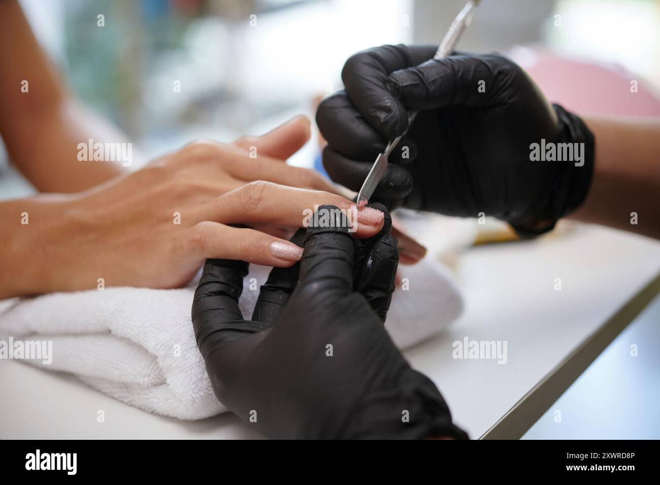 Performing Manicure Focusing on Nail Detail with Precision Stock Photo ...