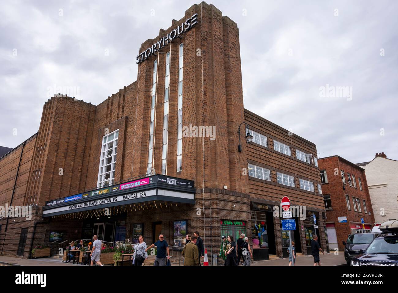 Historic brick building with art deco architecture, bustling with ...