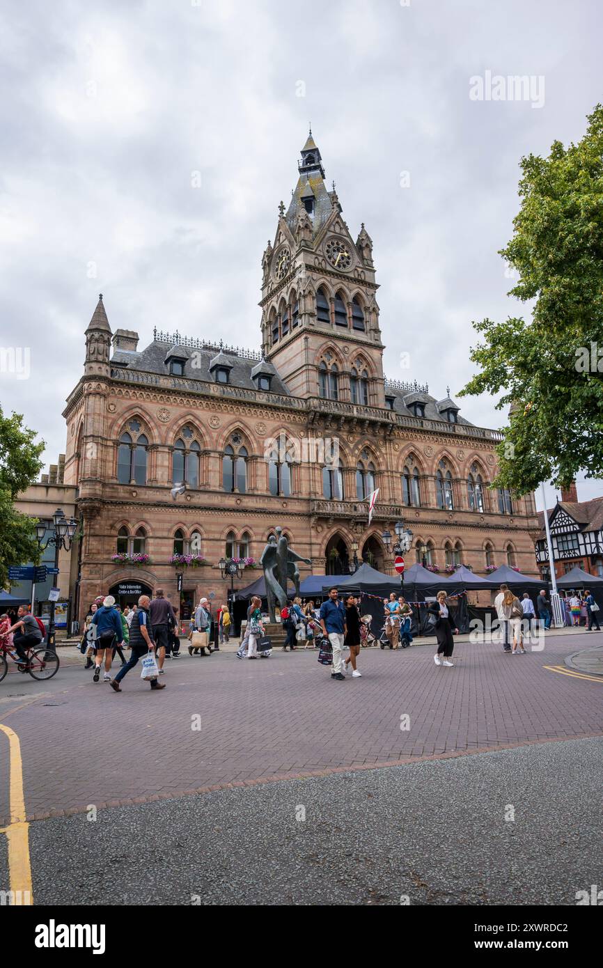 Historic building with Gothic architecture in a bustling town square ...