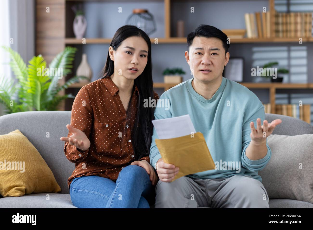 Mature couple talking paperwork serious hi-res stock photography and ...
