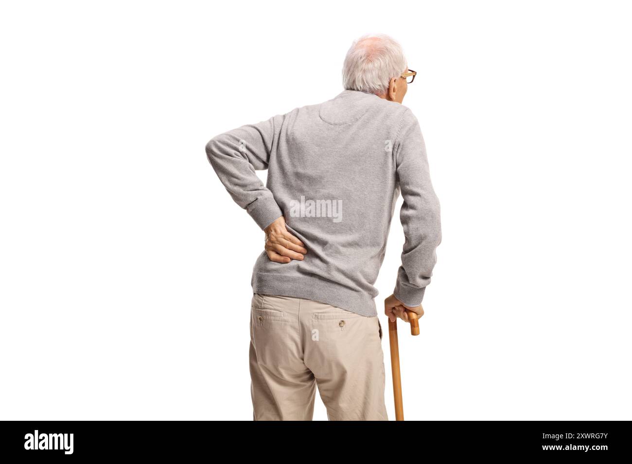 Rear view shot of an old man with a cane holding his back isolated on ...