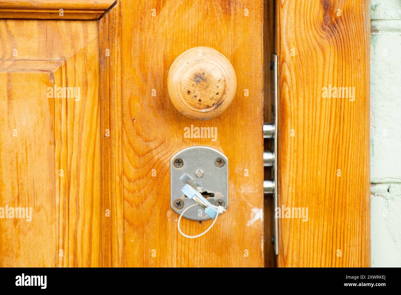 Wooden door with handle and lock and key for a summer house in Ukraine ...
