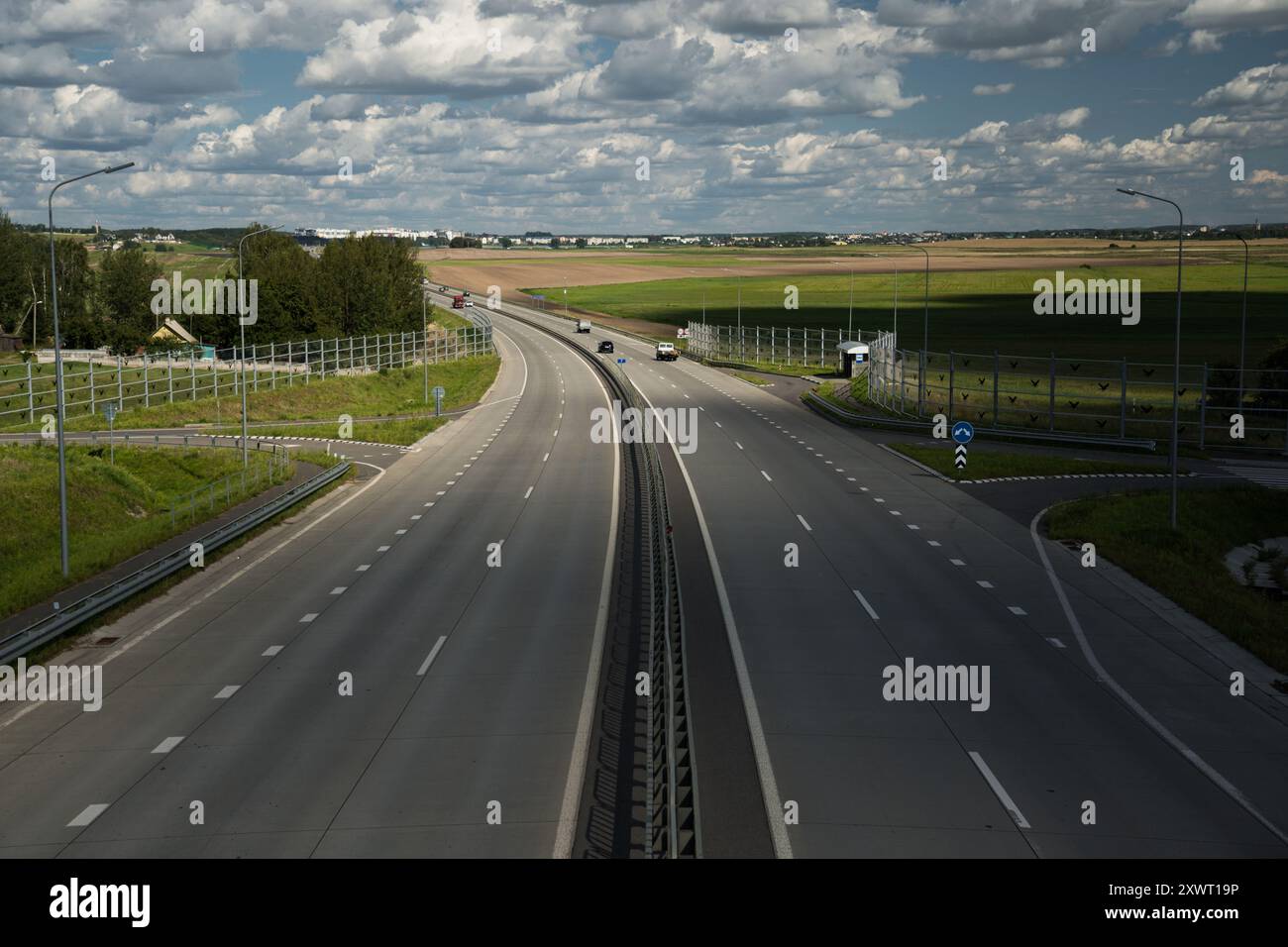 Highway view from above. Cars drive on the highway. Traffic of cars ...