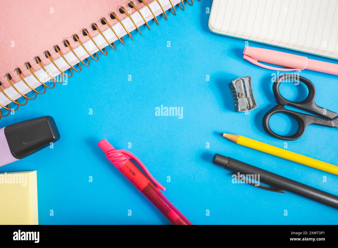 Different kind of school/office supplies for studying, on a blue ...