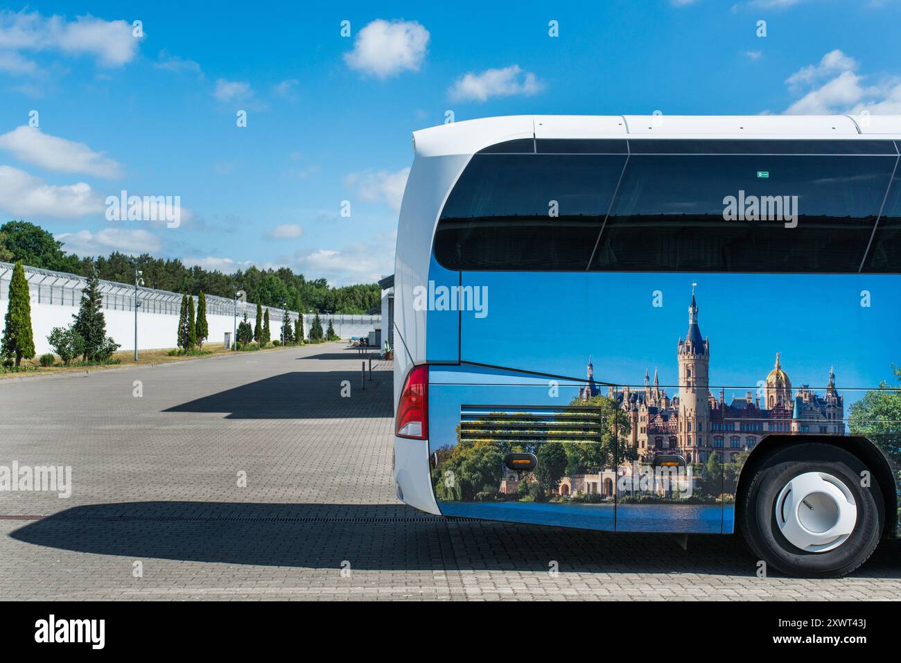 A visitor delegation's tour bus featuring an image of the Schwerin ...