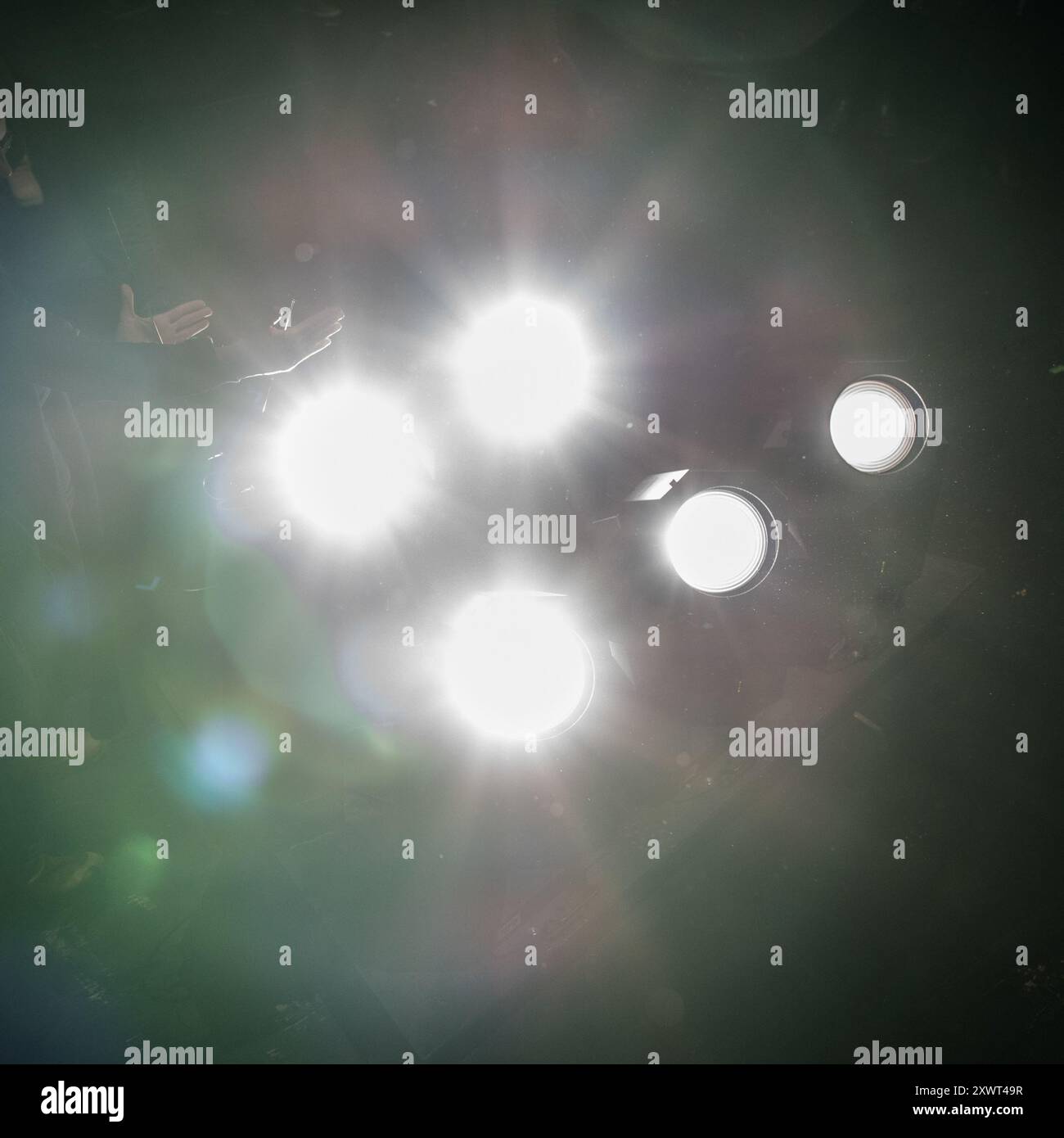 An abstract image of intense lights shining in a dark environment. This ...