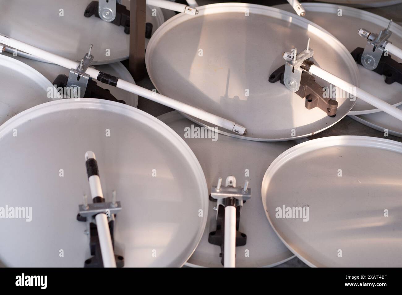 A close-up image showcasing a collection of modern satellite dishes ...