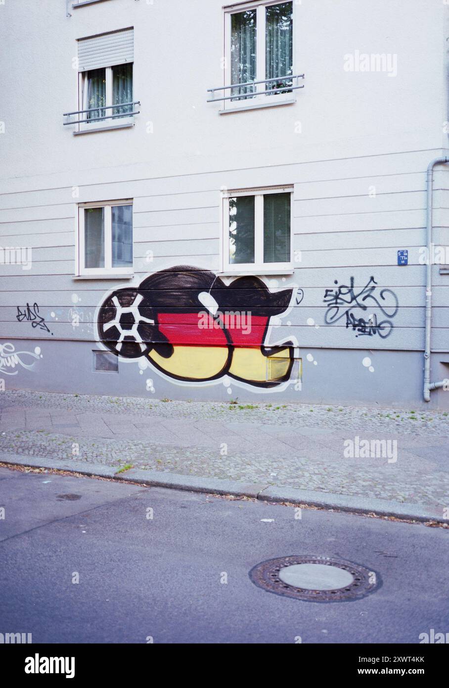 Street art mural depicting a soccer ball and the German flag on a ...