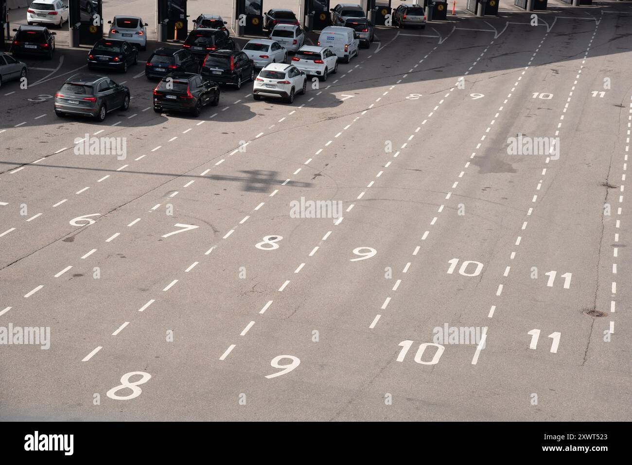 Vehicles in a raw on the port terminal ready for loading in a ferry ...