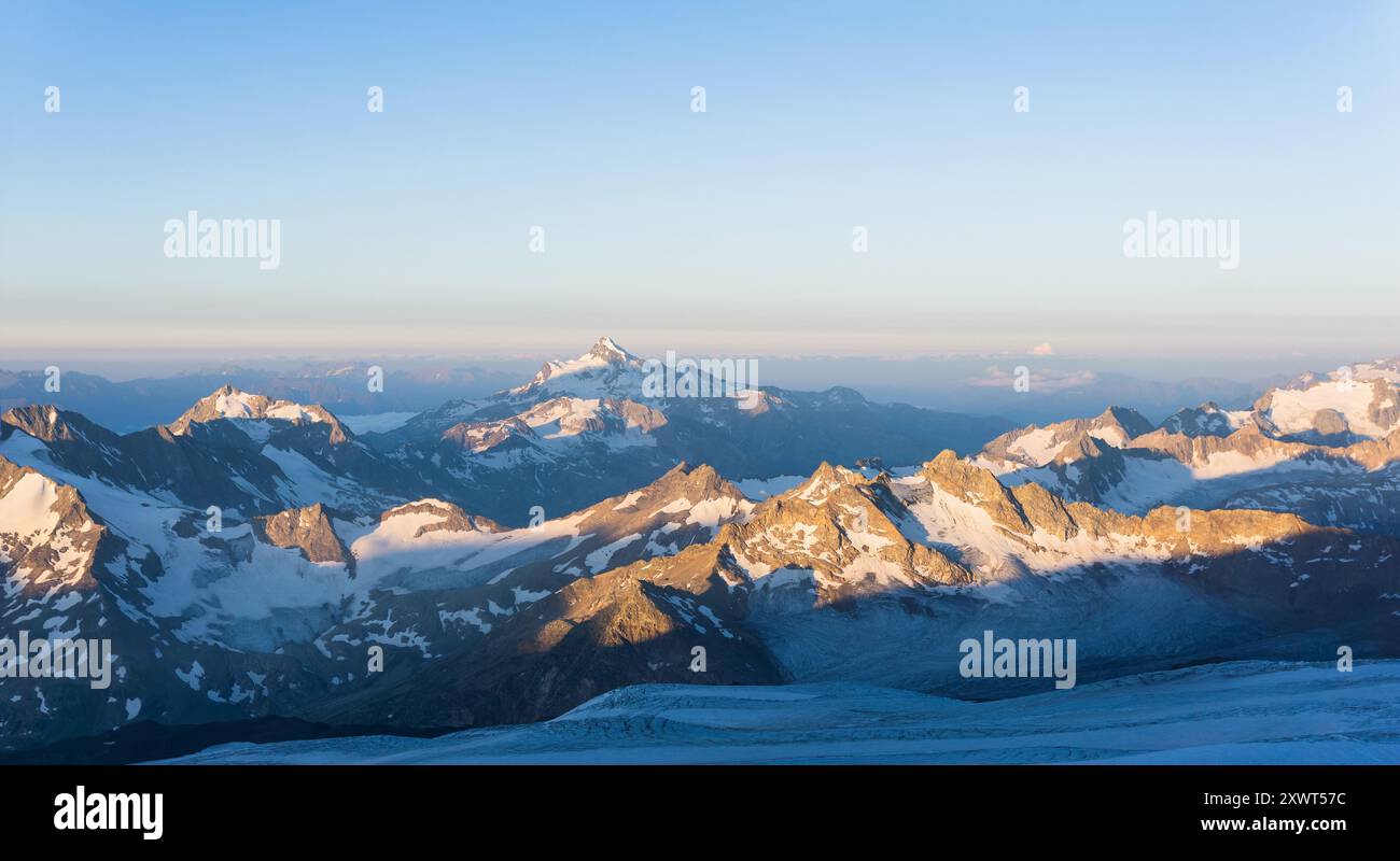 mountain peaks in morning dawn light, panoramic natural landscape Stock ...