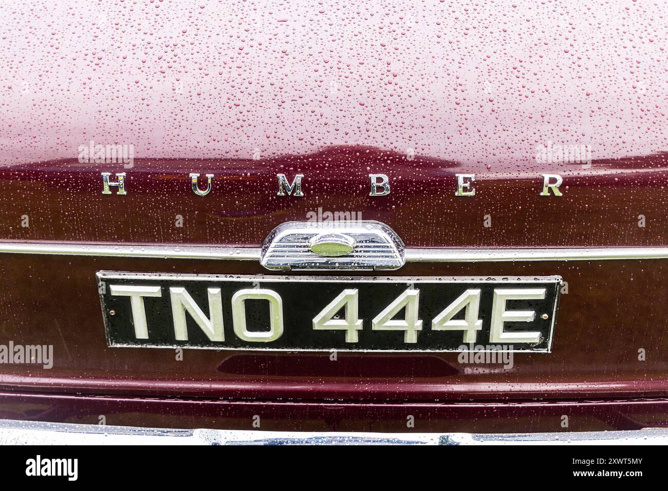 vintage classic humber chrome car boot badge and logo with raindrops on ...