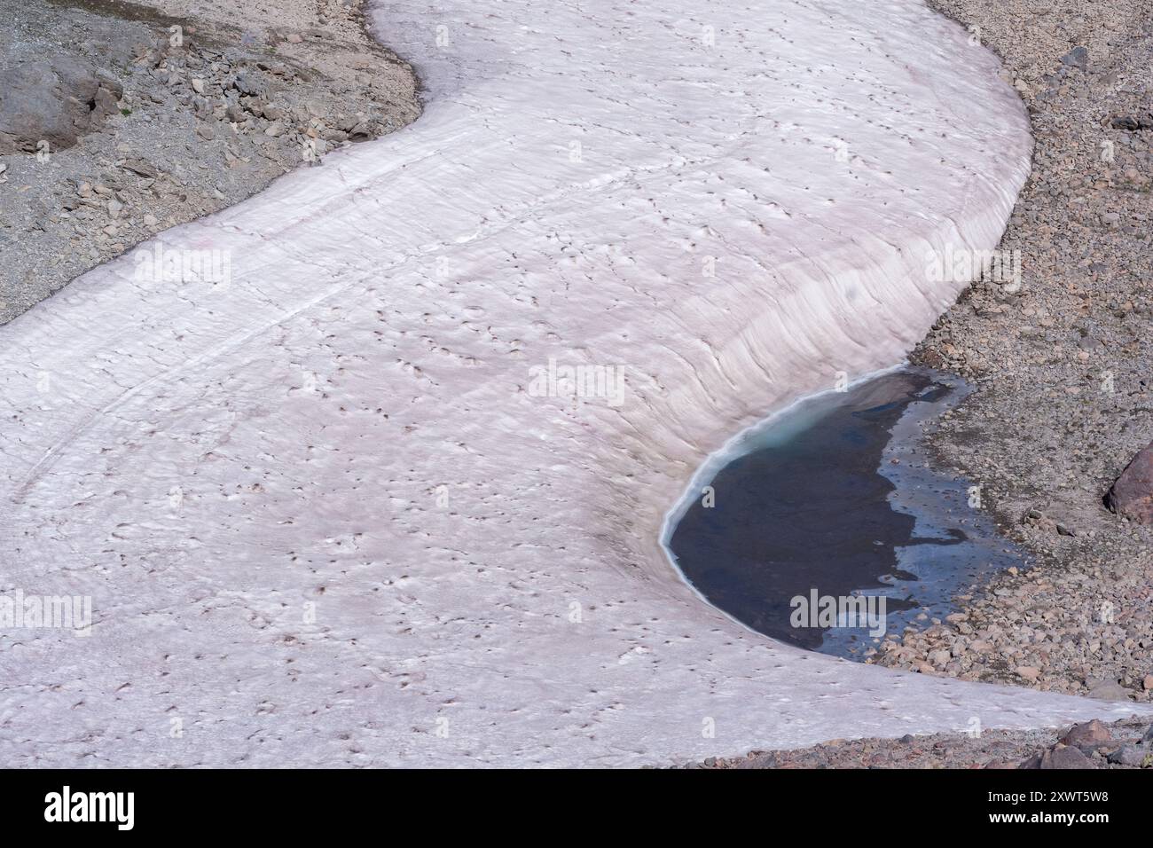 mountain landscape, rocky bed of melting glacier with frozen meltwater ...