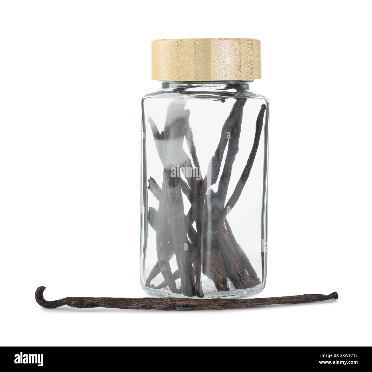 Vanilla pods in glass jar isolated on white Stock Photo - Alamy
