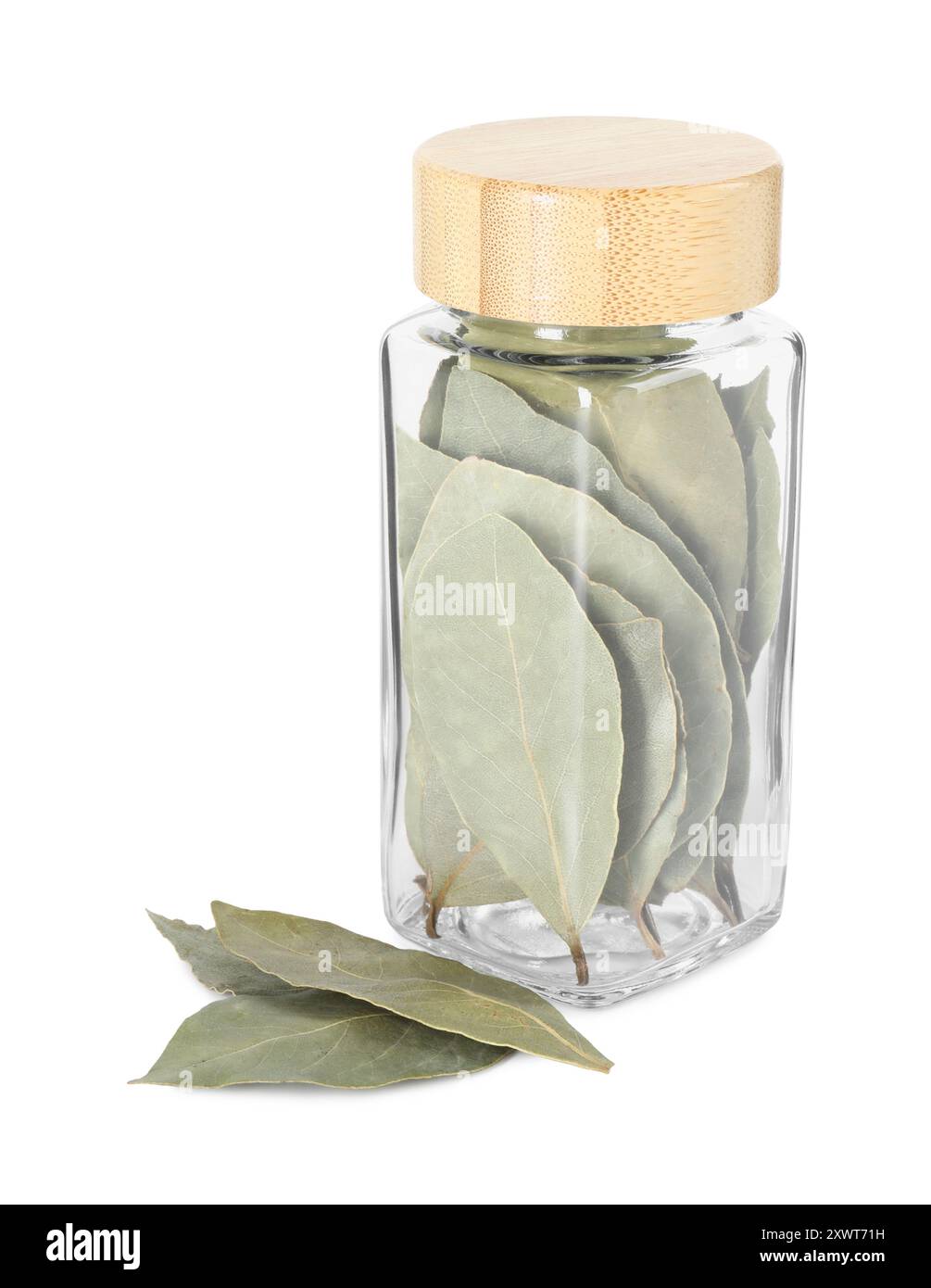 Dry bay leaves in glass jar isolated on white Stock Photo - Alamy