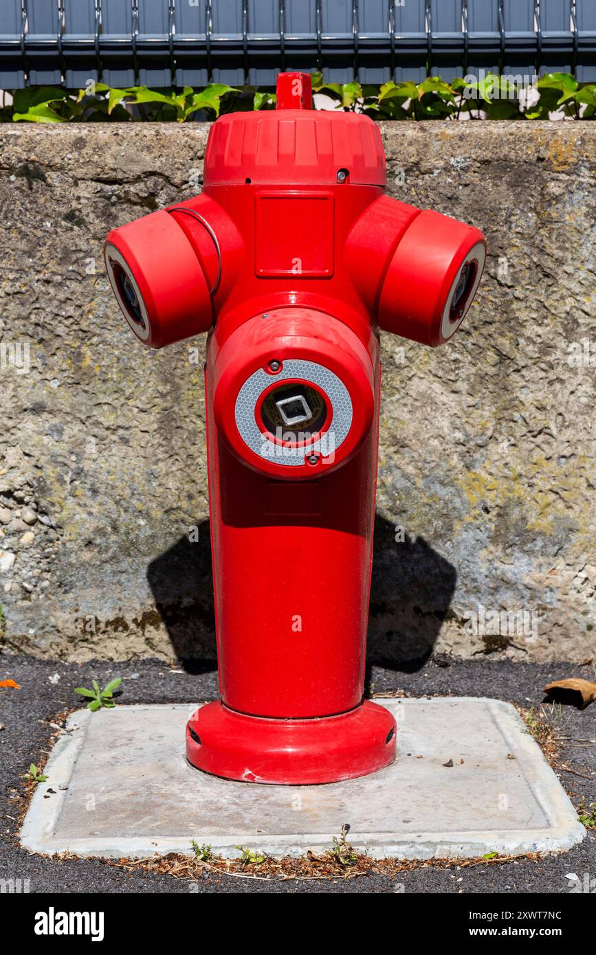 Fire hydrant in french street. Red triple fire hydrant on the street ...