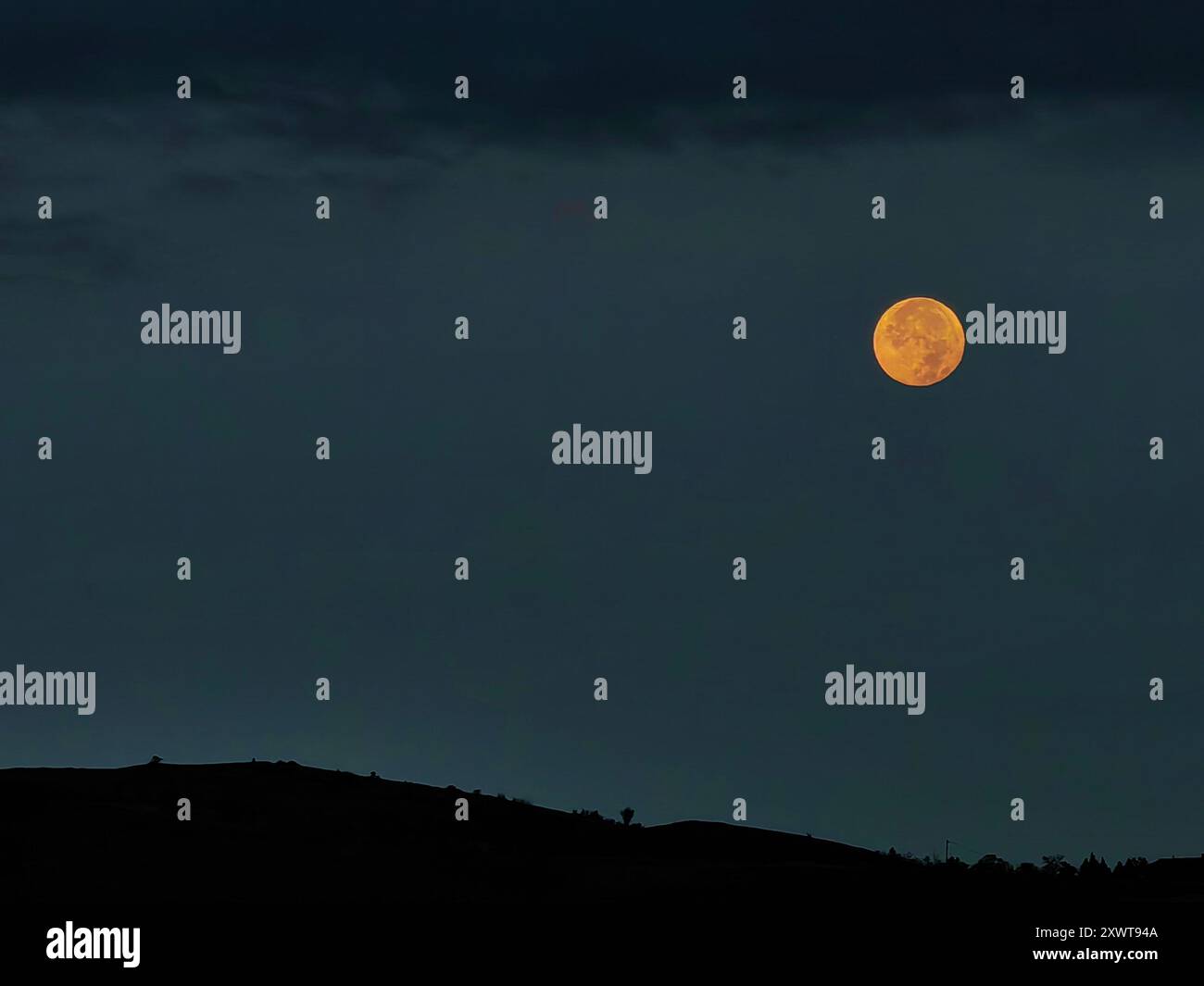 Full Moon Set in Dark Blue Sky Above Hill: Minutes Before a New Day ...