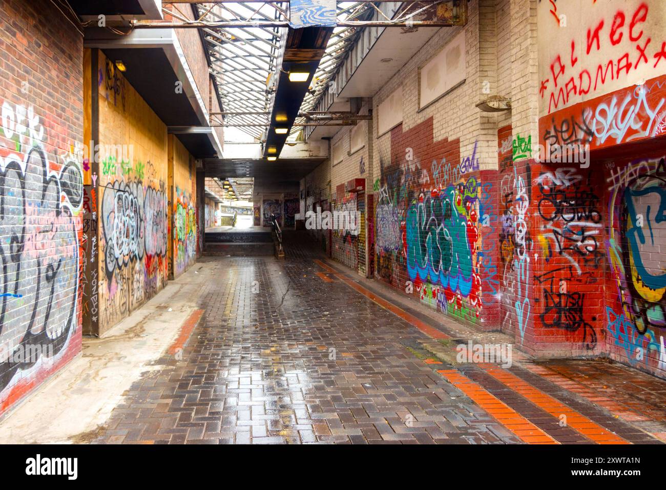 street art graffiti wall painting in abandoned shopping centre mall ...