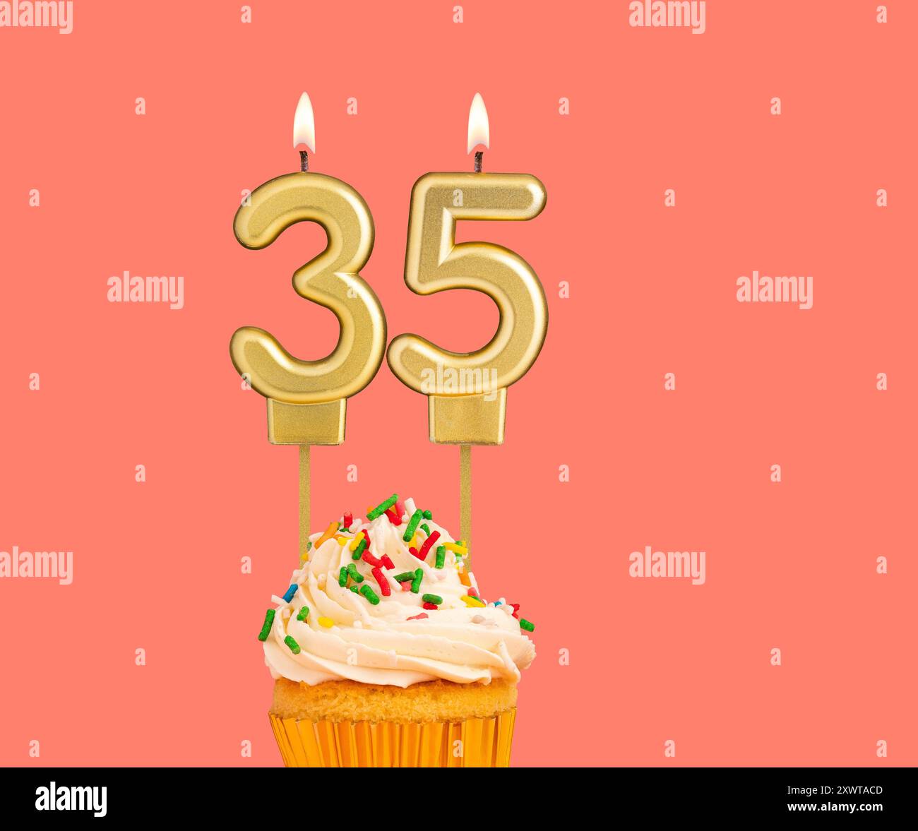 Birthday number 35 - Golden candle with cupcake Stock Photo - Alamy