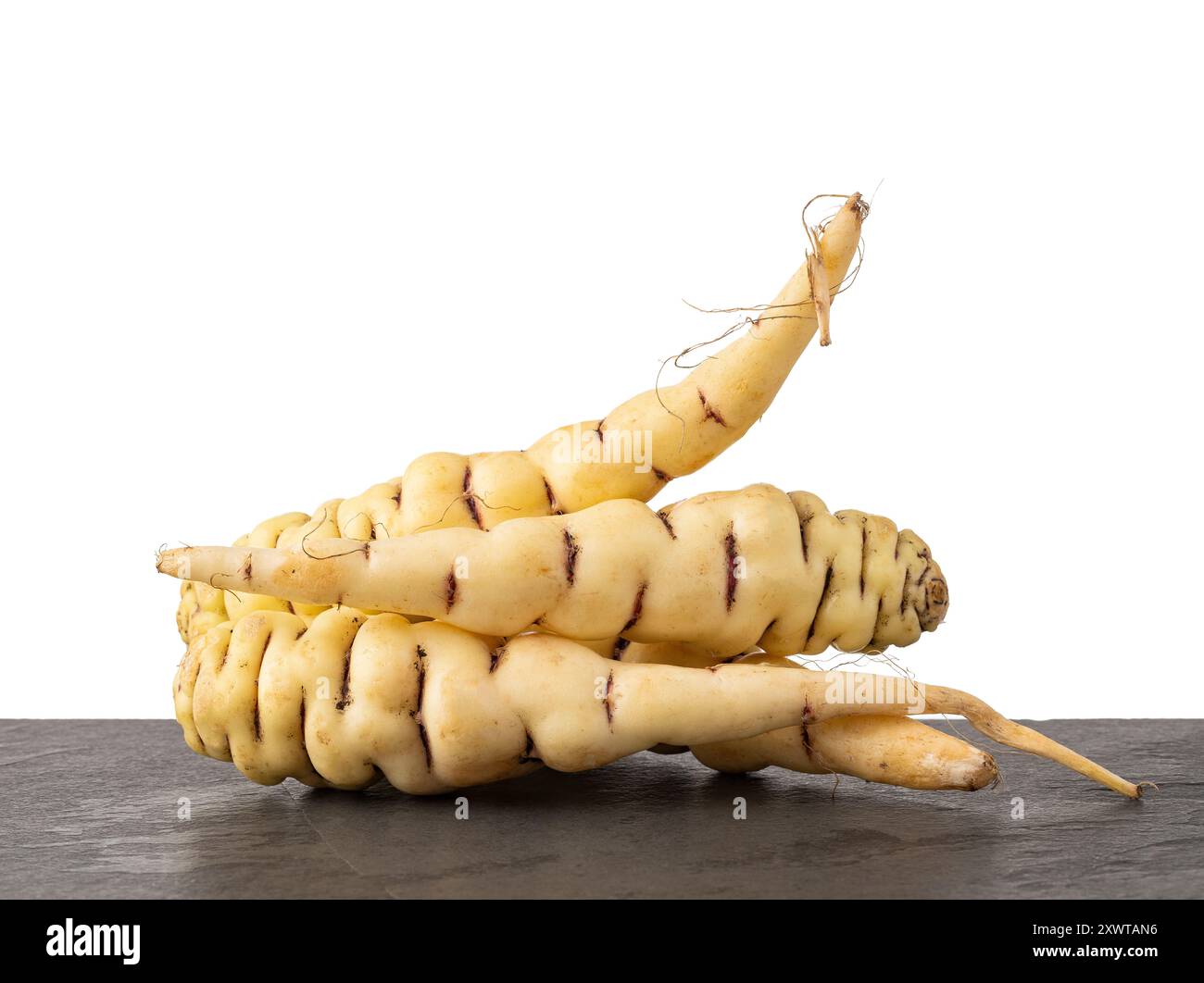 Tropaeolum tuberosum - Colombian organic cubios. Tubers on white ...