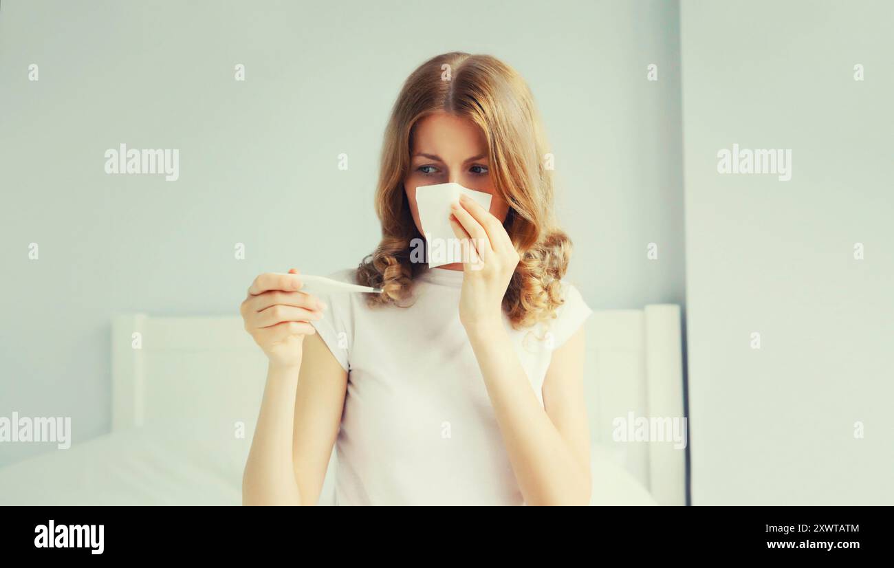 Portrait of sick upset woman sneezing blow nose using tissue and ...