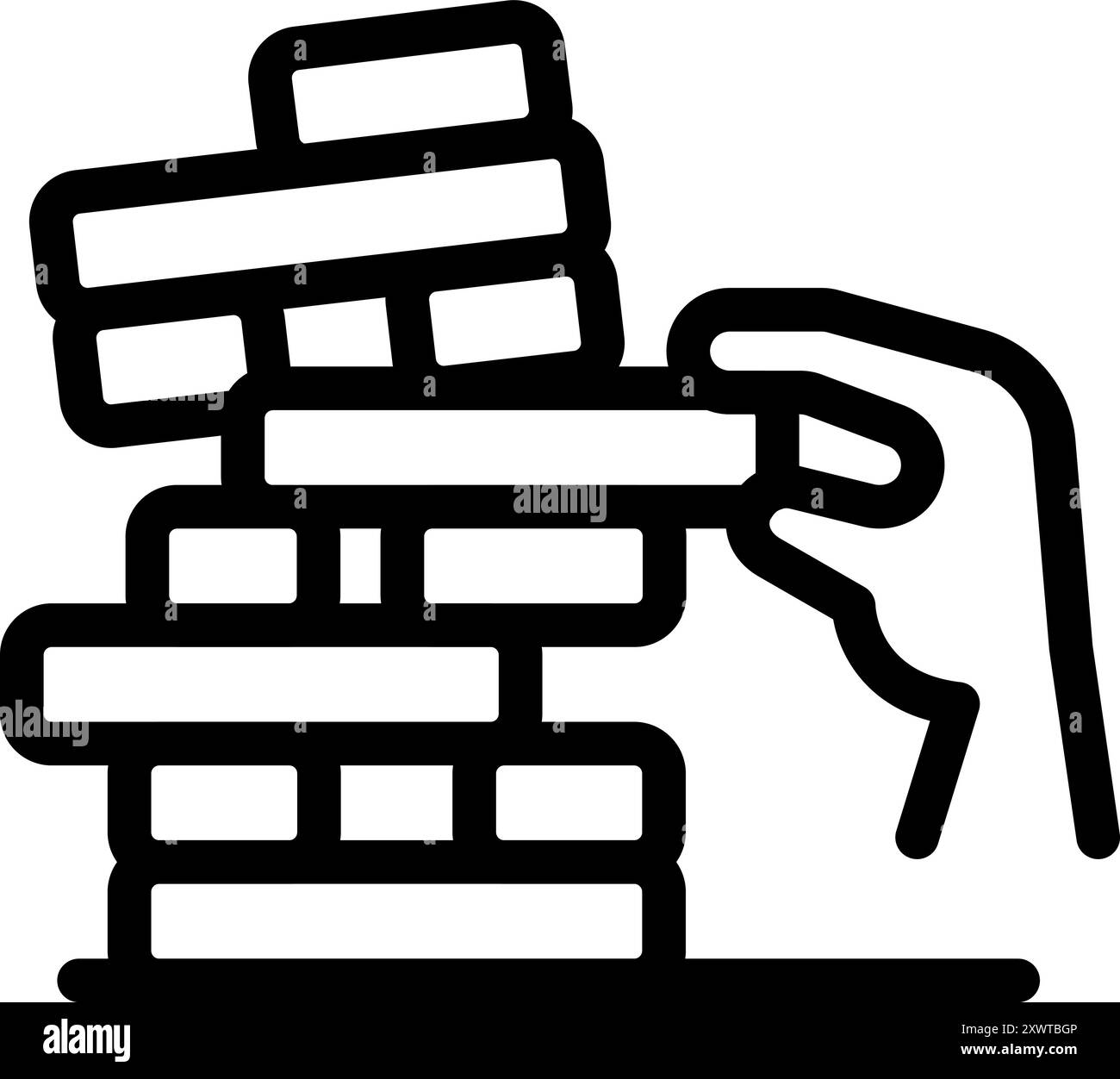 Hand is carefully removing a block from a tall tower of wooden blocks ...