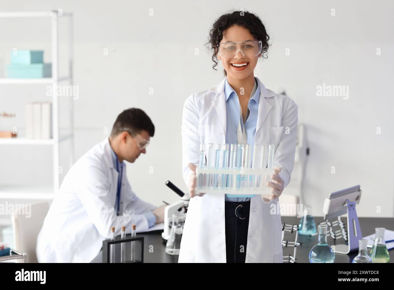 Female African-American chemist with test tubes in laboratory Stock ...