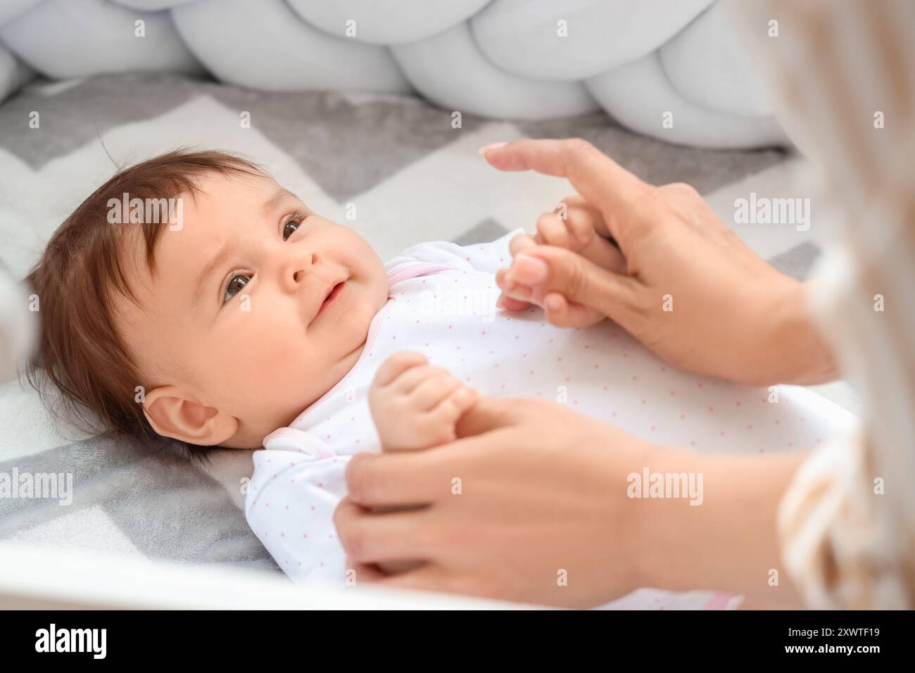 Little baby getting massage on bed, closeup Stock Photo - Alamy