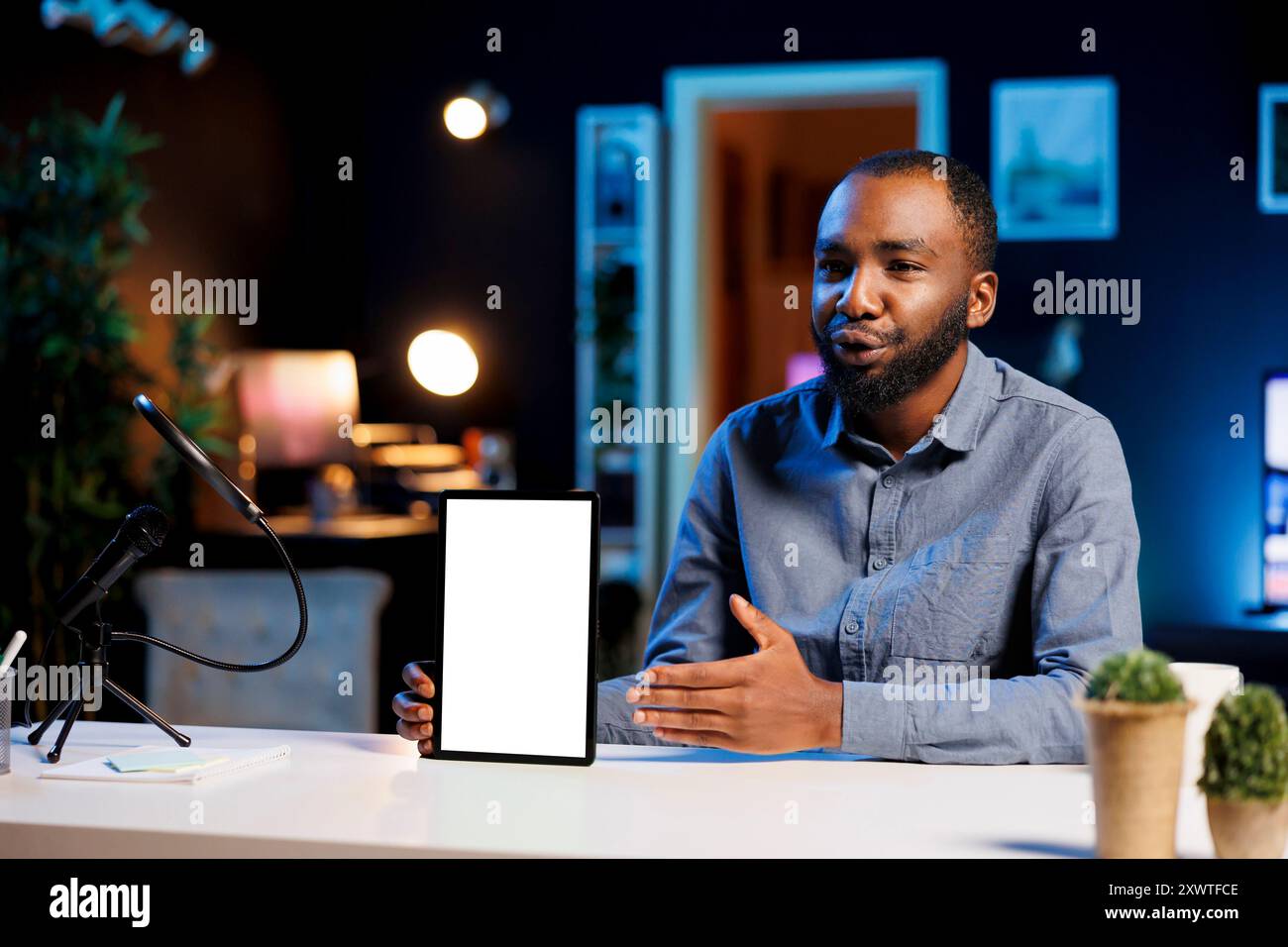 Tech guru excited to review newly released mockup tablet, comparing ...