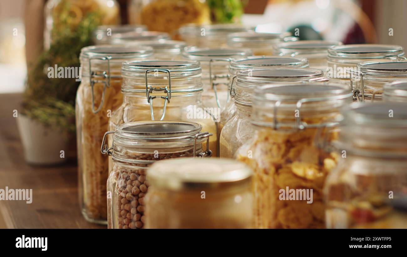 Close up on bulk products in reusable glass jars used by zero waste ...