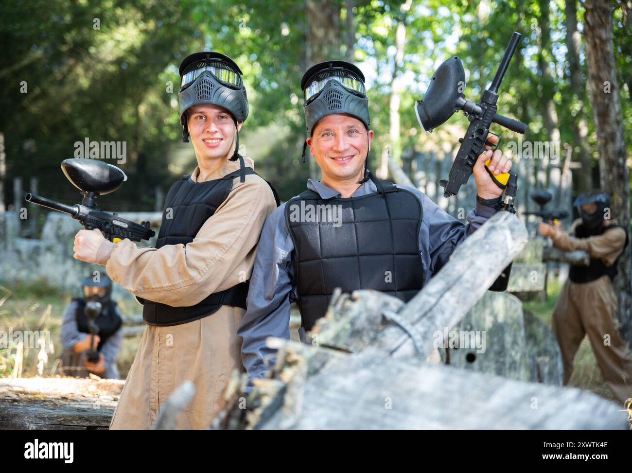 Two smiling paintball players in full gear having fun before game Stock ...