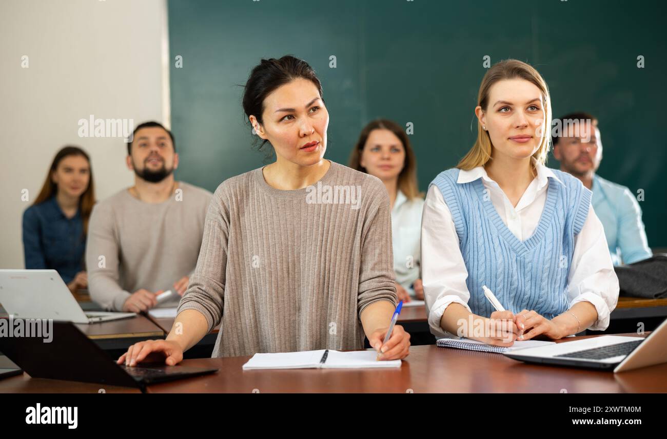 Concentrated students studying in the university auditorium Stock Photo ...