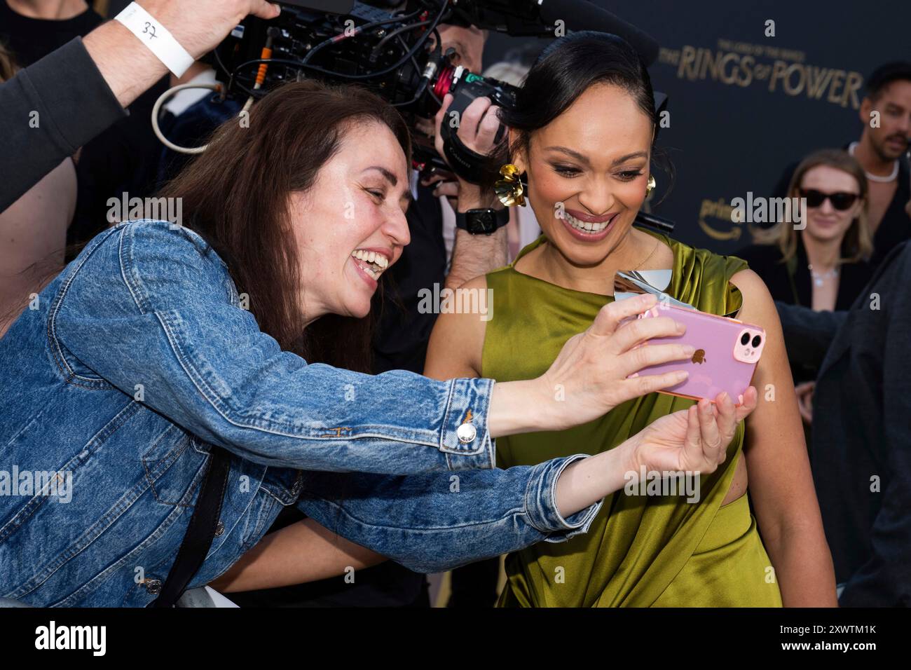 Cynthia Addai-Robinson poses for a selfie photograph with a fan at the ...