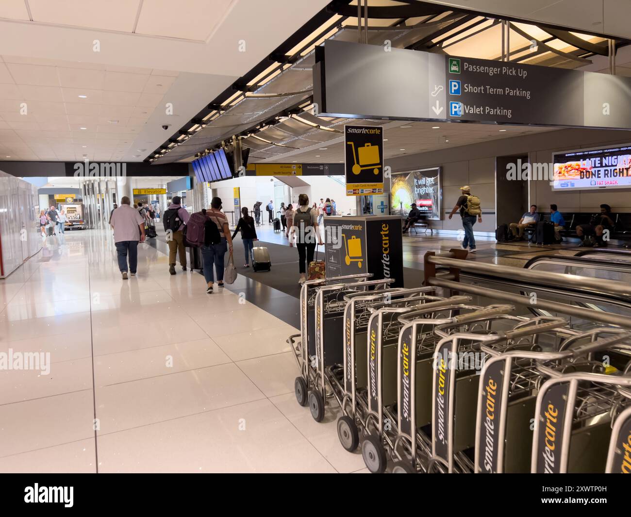 Smart Carte Luggage Carts Neatly Arranged in Airport Terminal Stock ...