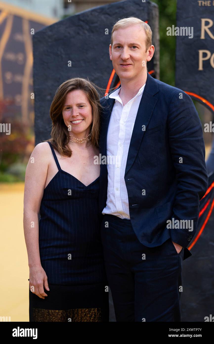 Nora Davis, left, and Patrick Mckay pose for photographers upon arrival ...