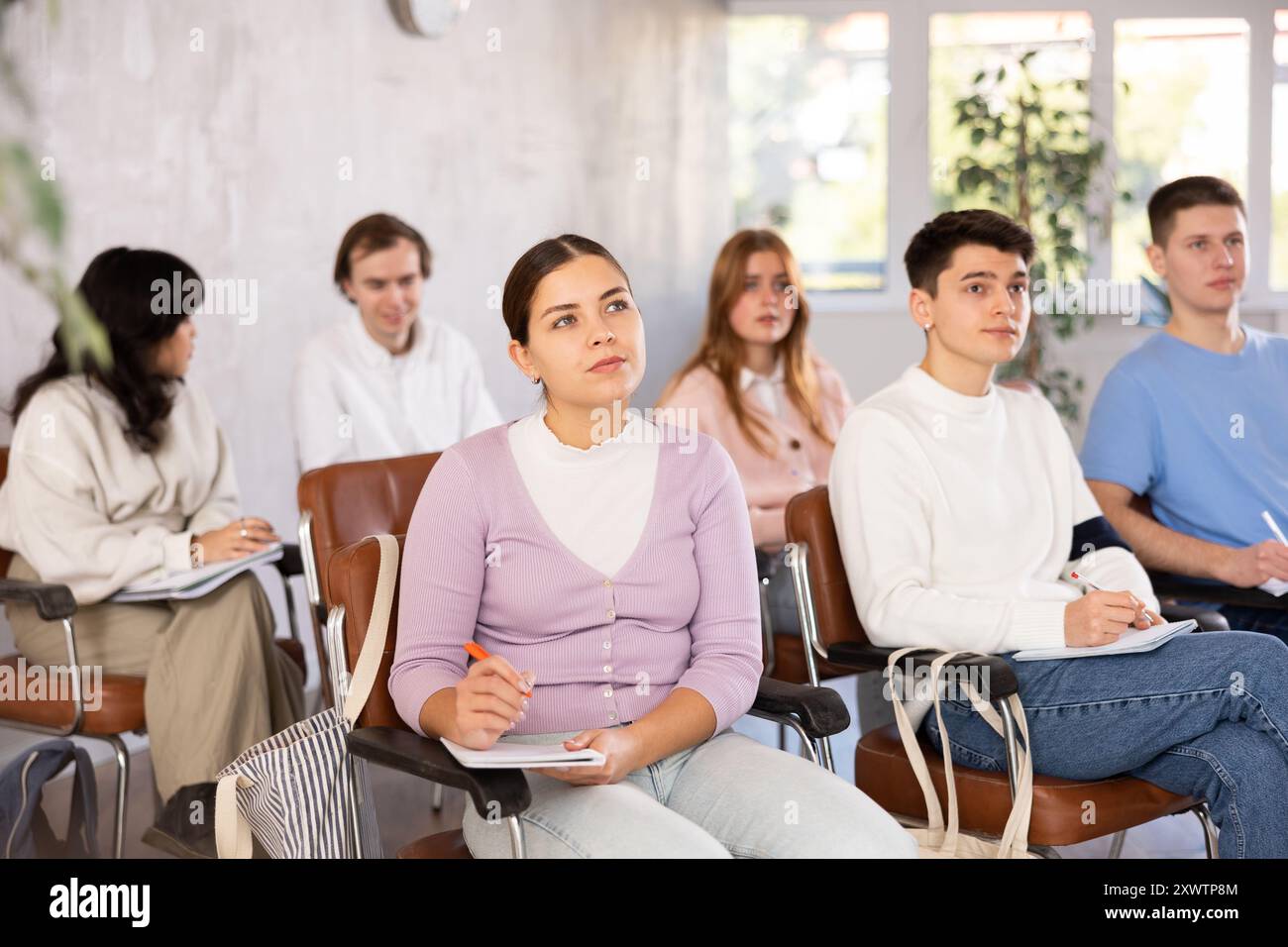 Teenager students listening in classroom school Stock Photo - Alamy