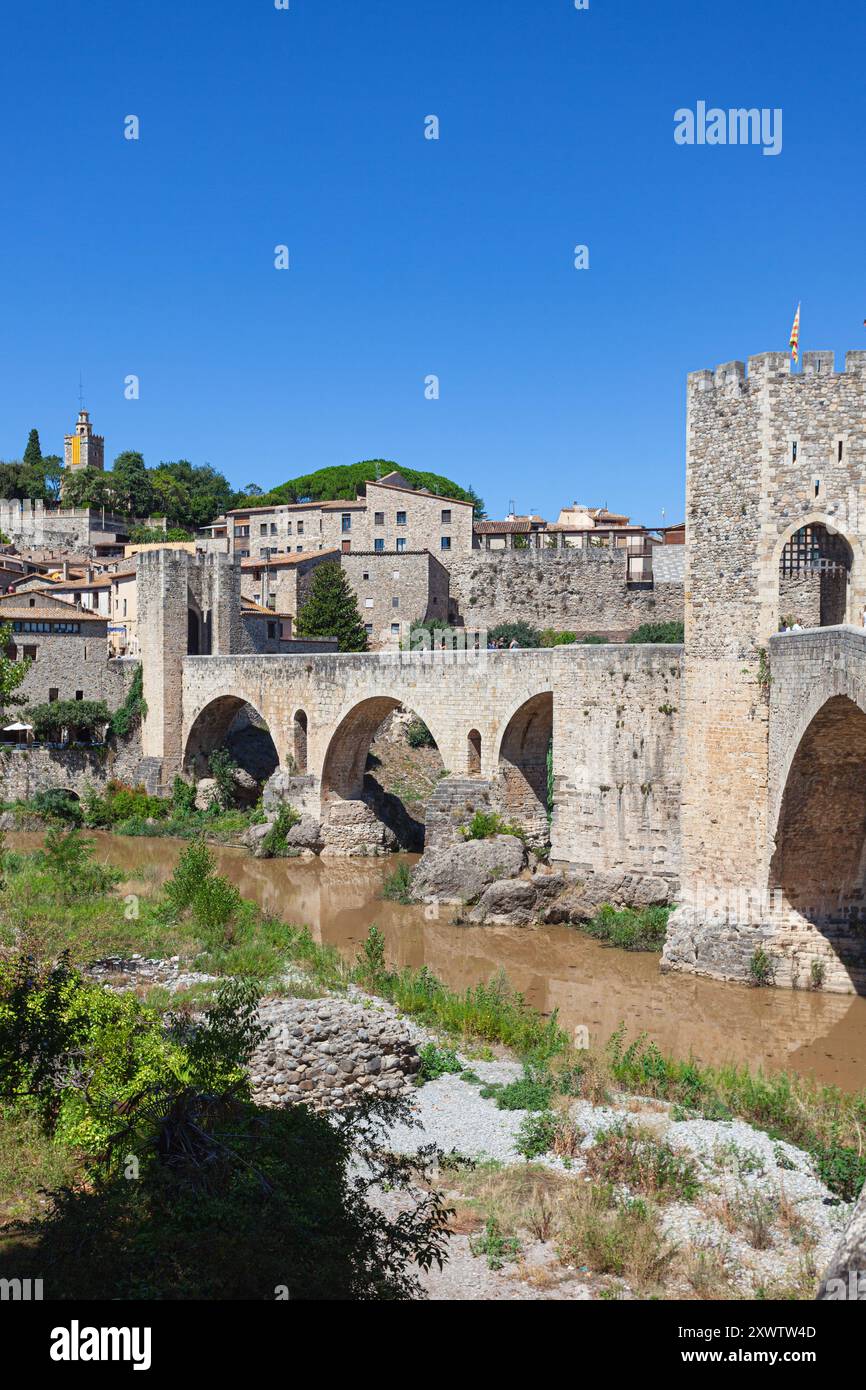 The 12th-century Romanesque bridge crossing over the Fluvià river in ...