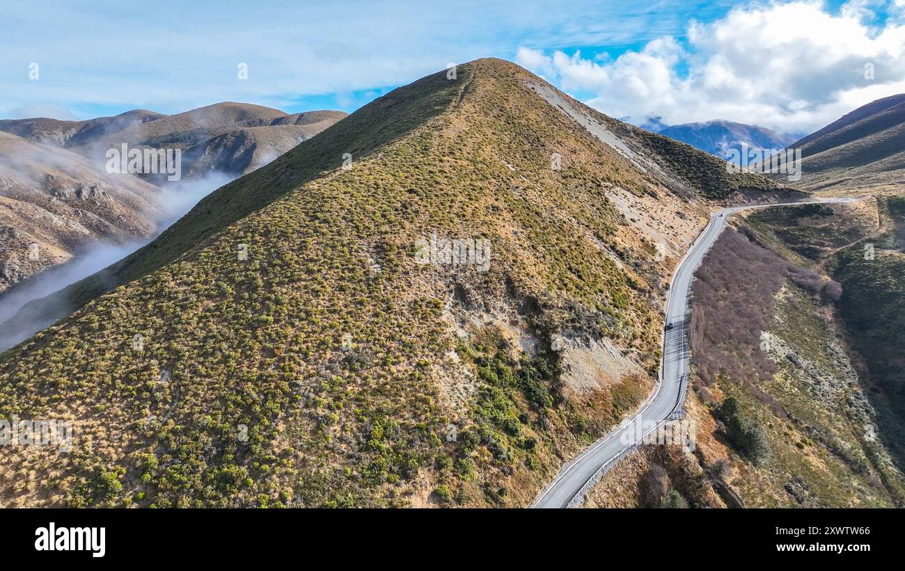 Aerial view of the mountains shrouded in cloud in Torlesse Tussocklands ...