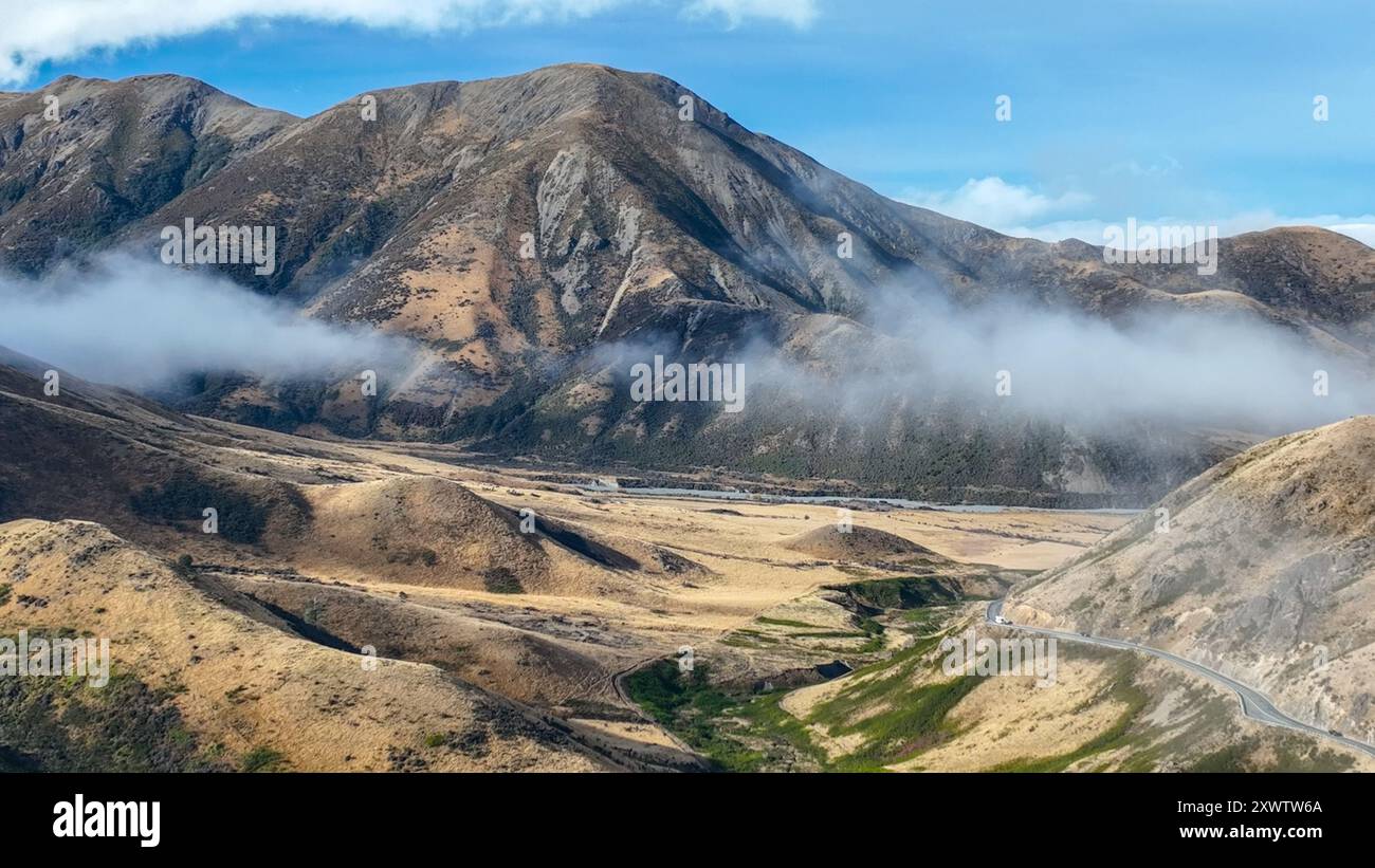Aerial view of the mountains shrouded in cloud in Torlesse Tussocklands ...