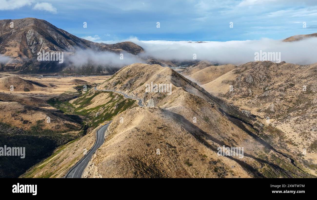 Aerial view of the mountains shrouded in cloud in Torlesse Tussocklands ...
