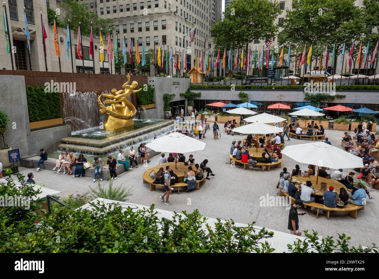 Umbrellas and tables are set up in Rockefeller Center Plaza during ...