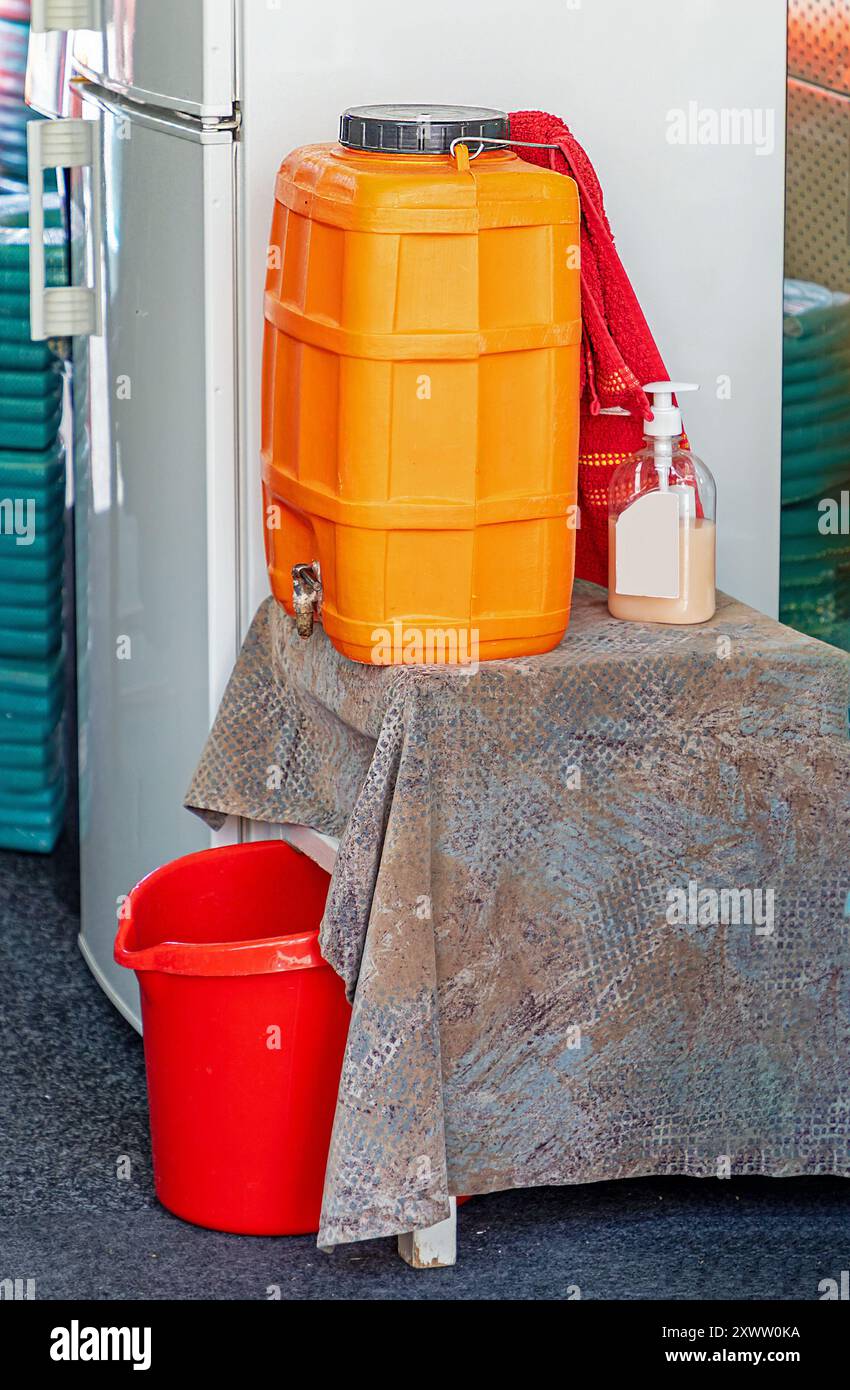 Close plastic water tank inside countryside used for camping Stock ...