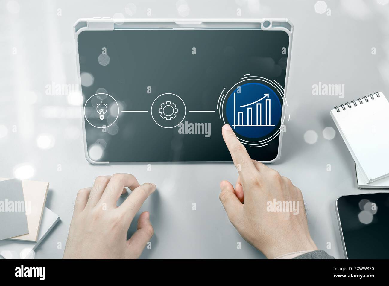 A person is pointing at a graph on a tablet. The graph shows a downward ...