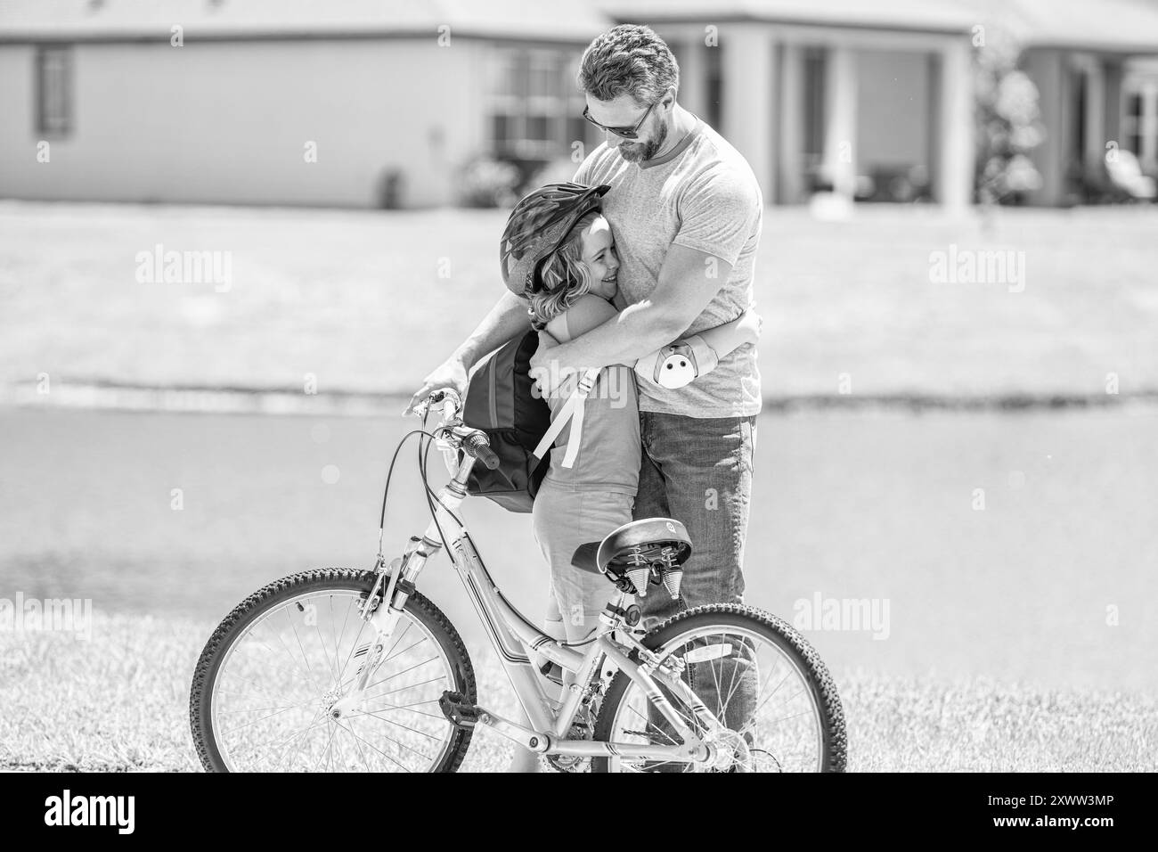 active father setting a example for fathers son. fathers parenting with ...